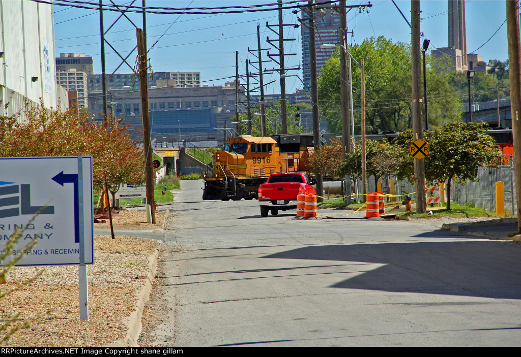 BNSF 9916 leads a Nb empty coal train up Thur Kc.
